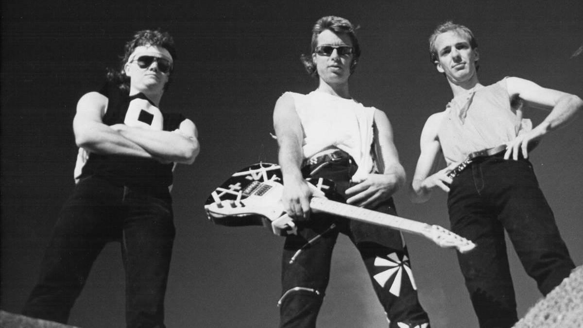 Promotional shot of legendary Newcastle rock band DV8 (Greg Bryce centre)